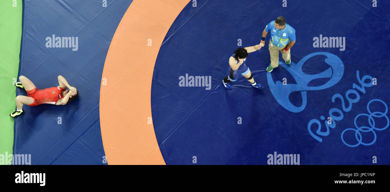 Japan's Sara Dosho (C) celebrates after defeating Natalia Vorobeva (L ...