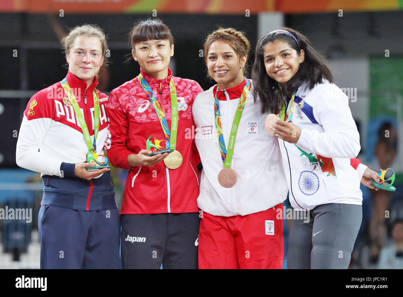 Gold medalist Kaori Icho (2nd from L) of Japan, silver medalist ...