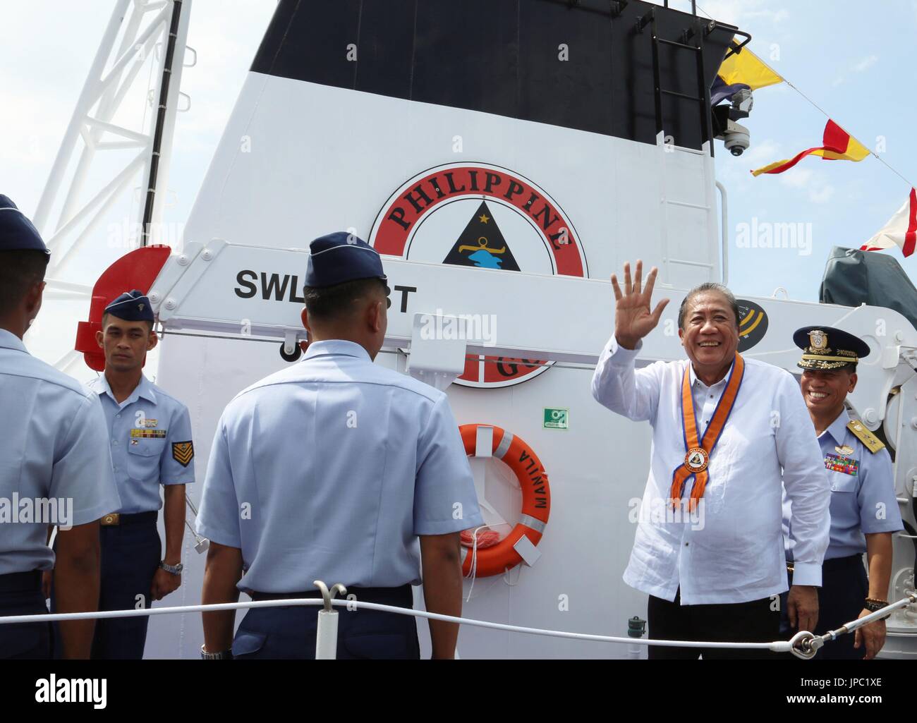 Philippine Transportation Secretary Arthur Tugade waves on Aug. 18 ...