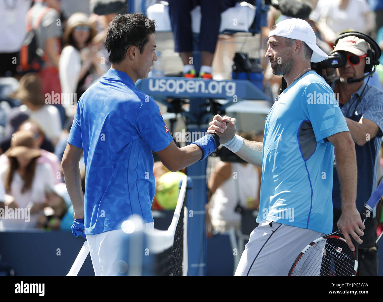 Kei Nishikori (L) of Japan shakes hands with Germany's Benjamin Becker ...
