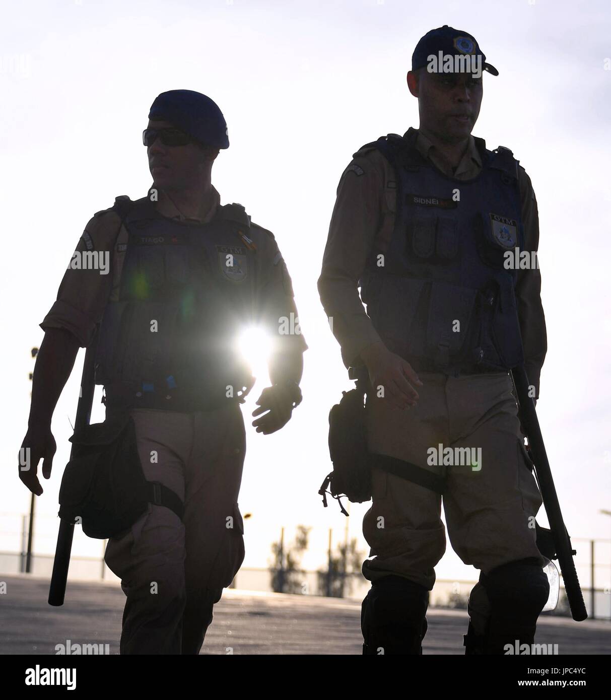 Security officers patrol around the Maracana Stadium at sundown in Rio ...