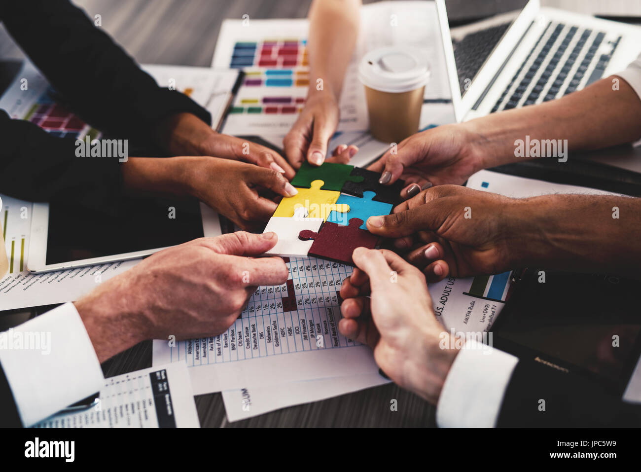 Teamwork of partners. Concept of integration and startup with puzzle ...