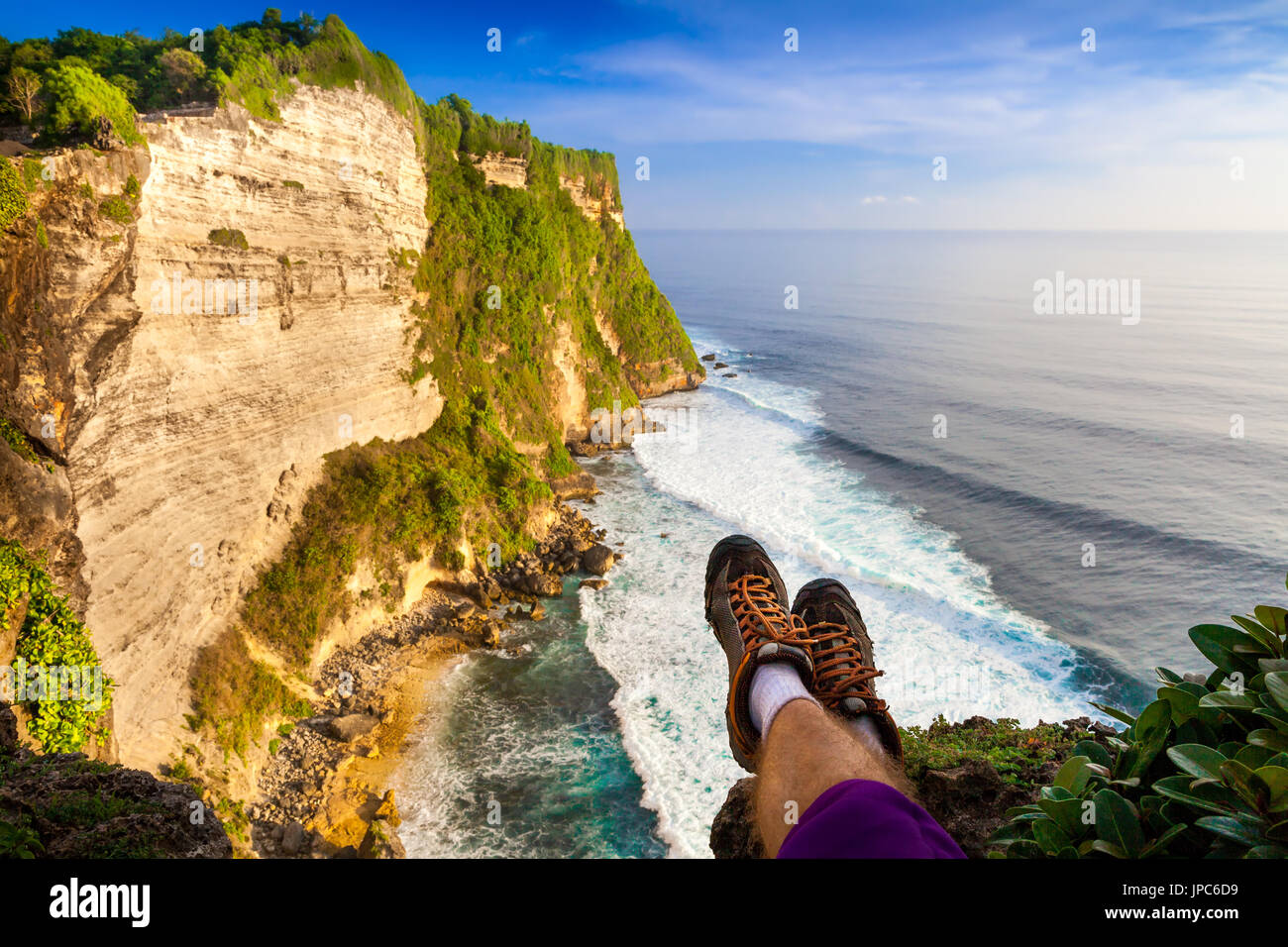 First-person view of Uluwatu cliff with pavilion and sea in Bali ...
