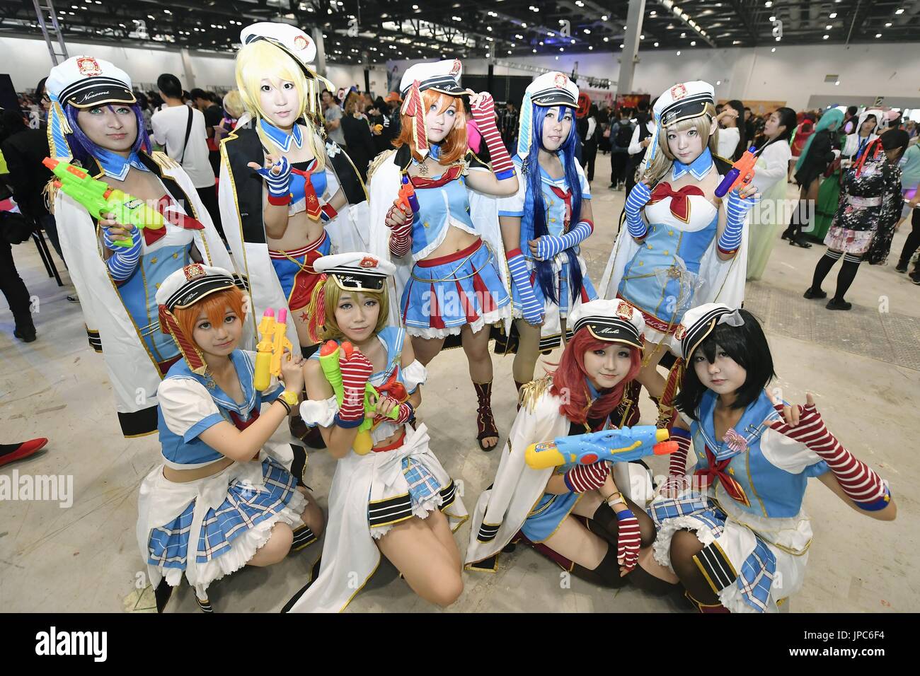 Chinese cosplayers pose for a photo during an anime event organized by ...