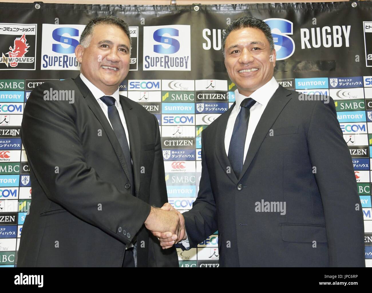 Japan coach Jamie Joseph (L) and new Sunwolves coach Filo Tiatia shake ...