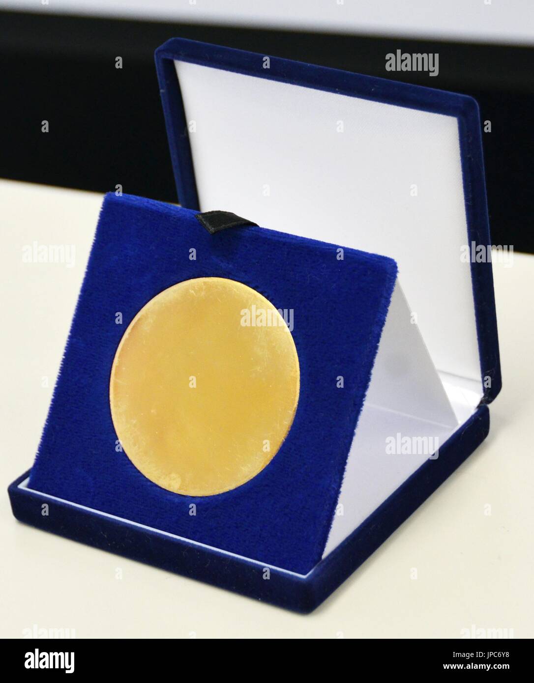 A prototype gold medal for the 2020 Tokyo Olympic and Paralympic Games ...