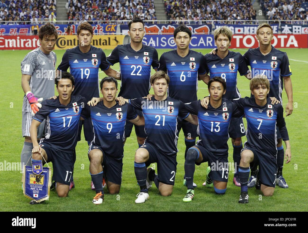 Starting members of the Japanese soccer team pose for photos at Saitama ...