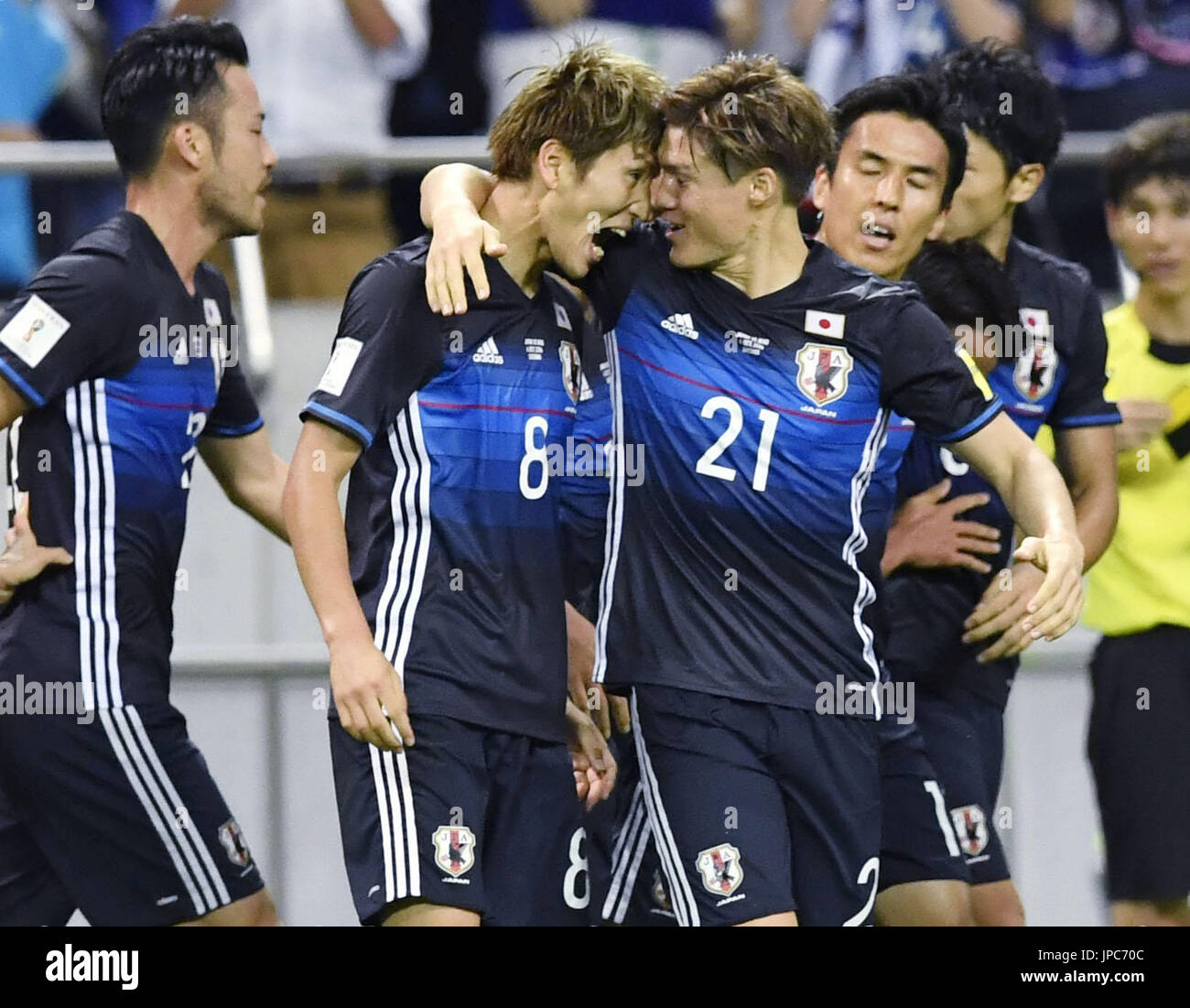 Genki Haraguchi of Japan (2nd from L) celebrates with his teammates ...