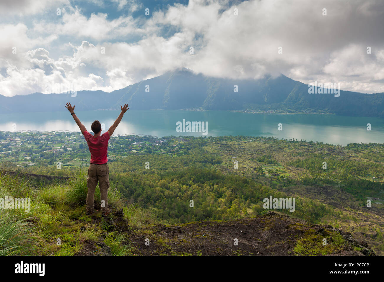 Happy hiker winning reaching life goal, success, freedom and happiness ...