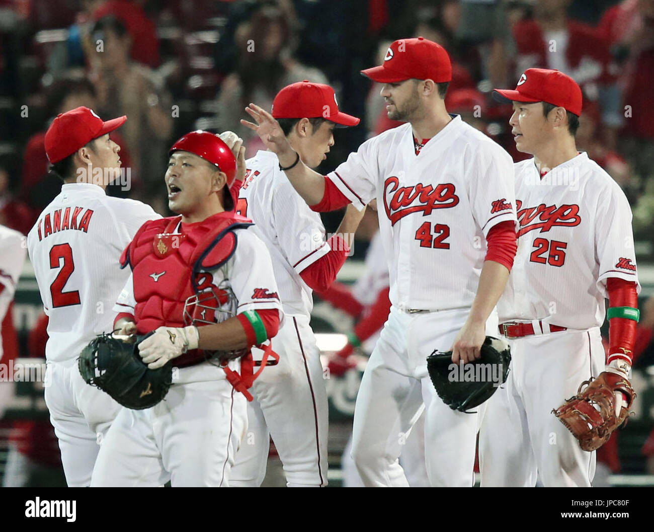 Hiroshima Carp players celebrate their 5-0 win over DeNA BayStars in ...