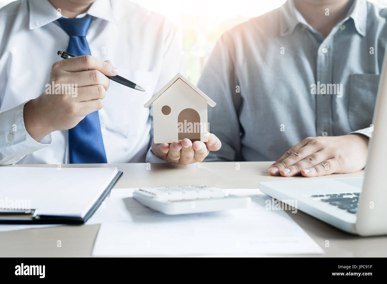 Real estate agent to present the property (house) to customer Stock ...