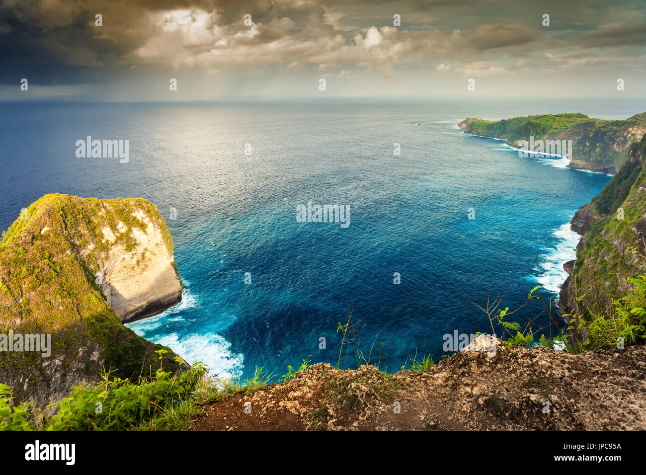 Azure beach with rocky mountains and clear water of Indian ocean at ...