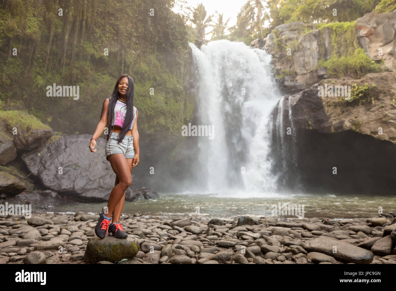 Young woman near waterfall, bali, indonesia Stock Photo - Alamy