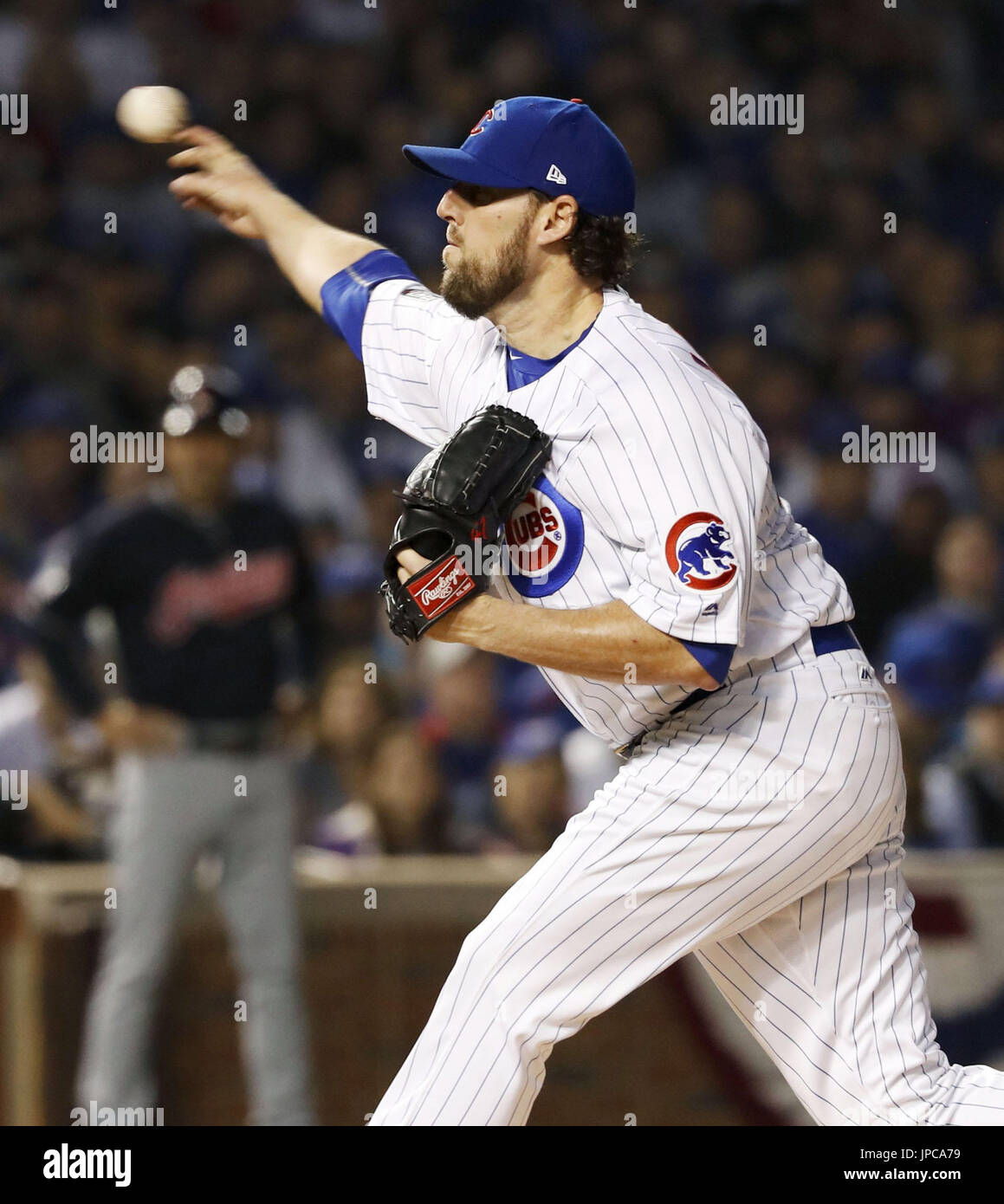Chicago Cubs' starting pitcher John Lackey throws against the Cleveland ...