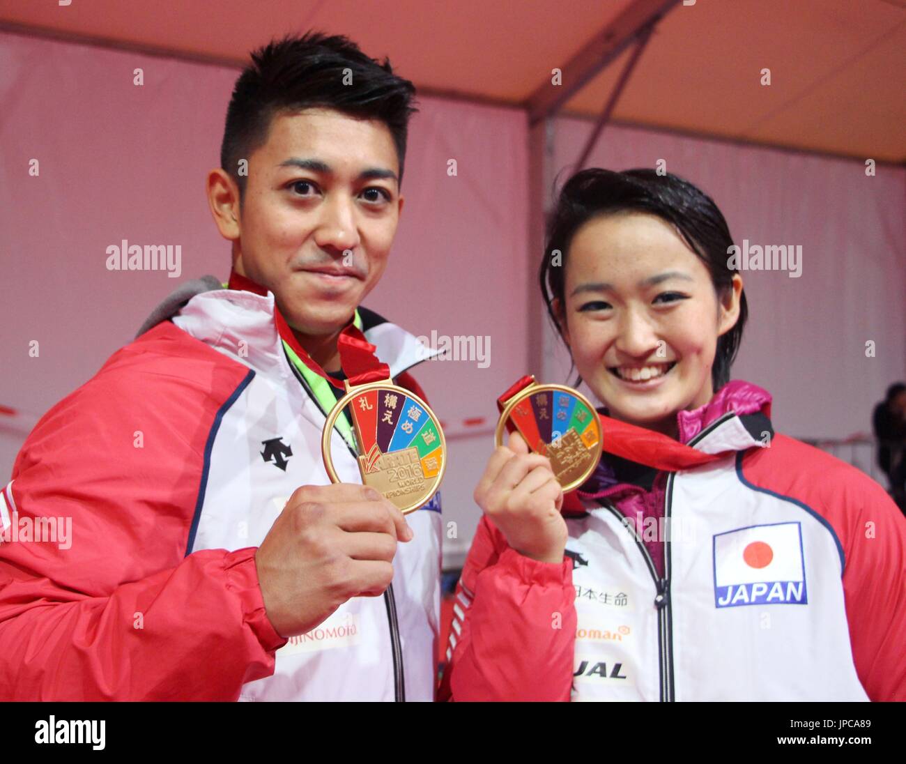 Japan's Ryo Kiyuna (L) and Kiyou Shimizu pose with their gold medals ...