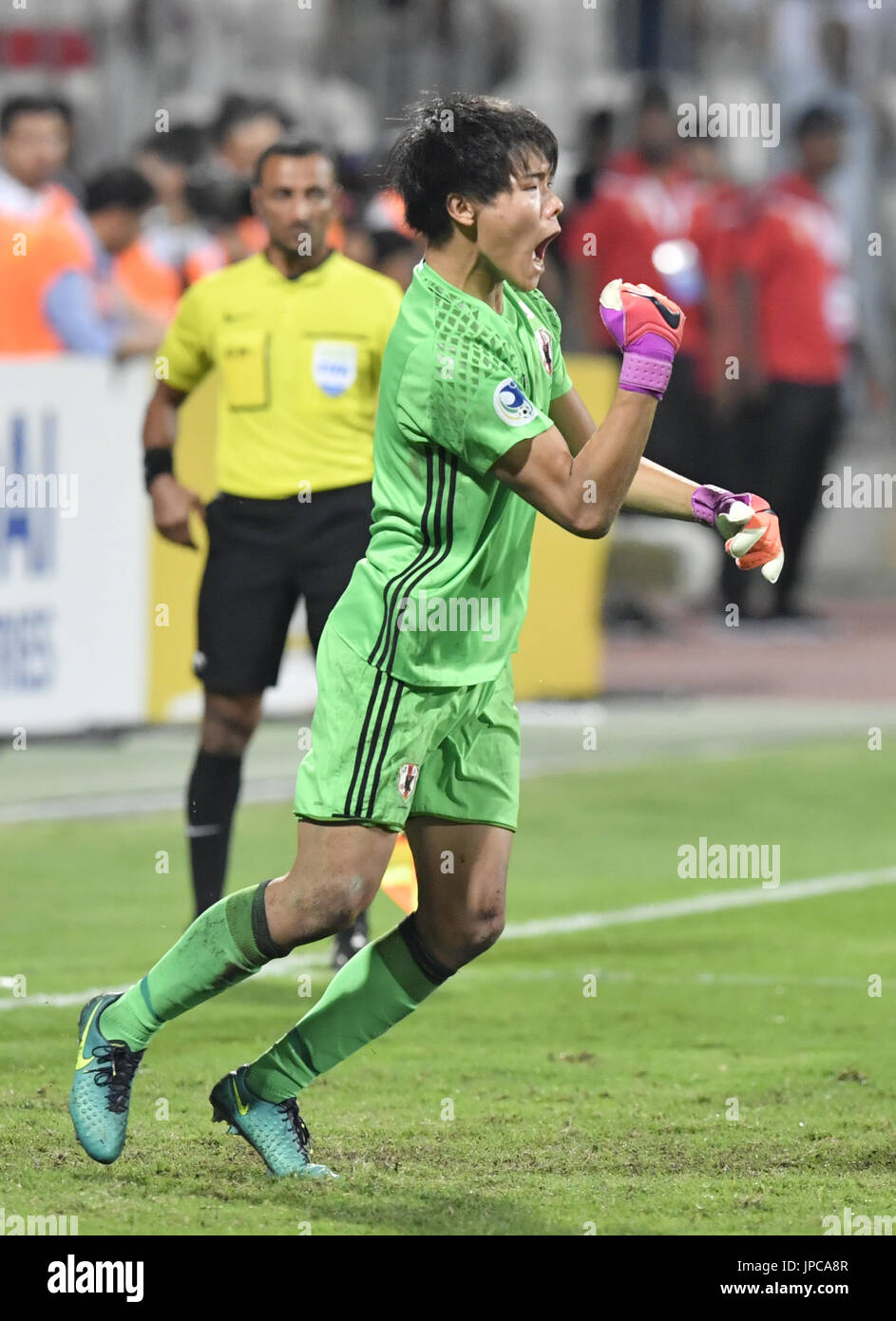 Japan goalkeeper Ryosuke Kojima reacts after Saudi Arabia's Abdullah Magrshi missed in a penalty ...