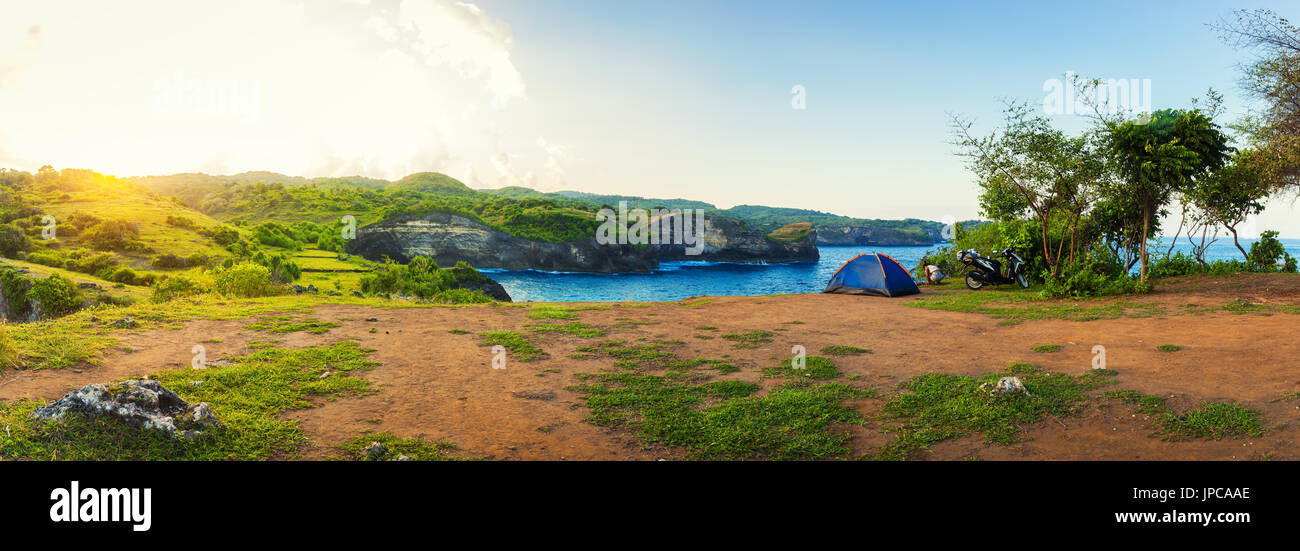 Azure beach with rocky mountains and clear sea water on background ...