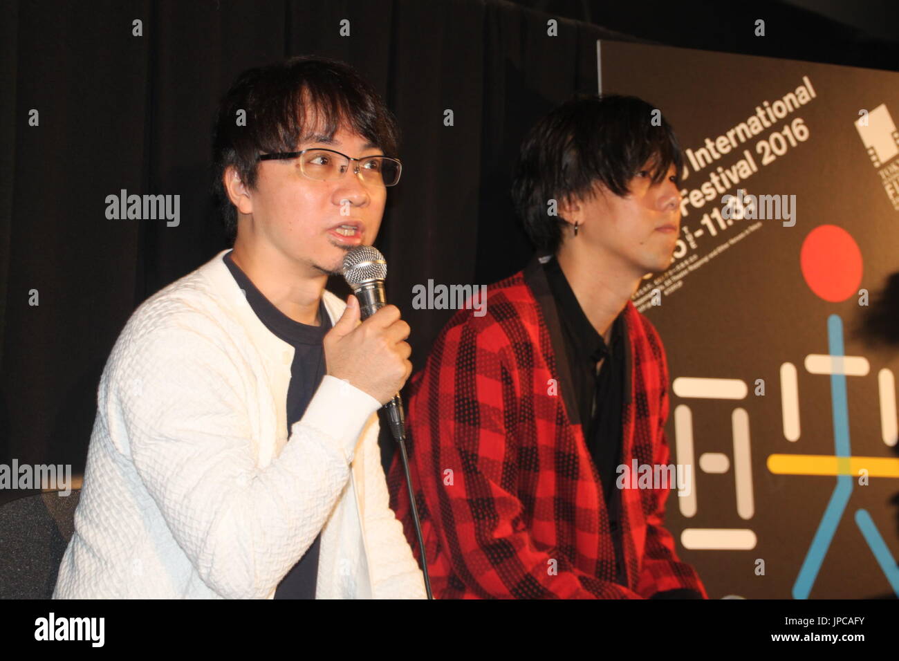 Japanese animation film director Makoto Shinkai (L) and RADWIMP singer ...