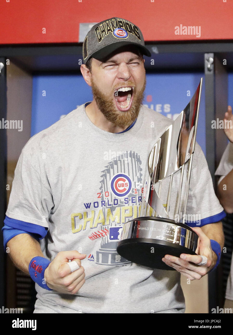The Chicago Cubs' Ben Zobrist celebrates with the MVP trophy after his ...