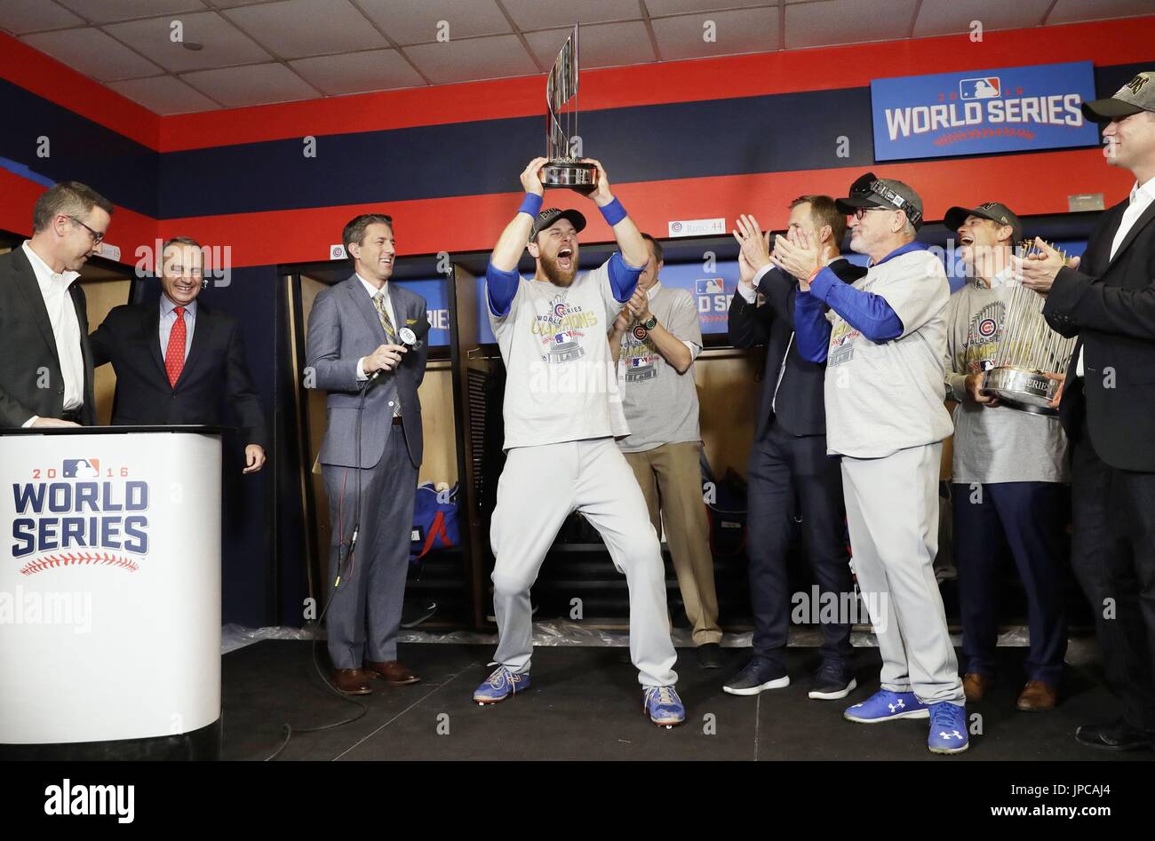 The Chicago Cubs' Ben Zobrist celebrates with the MVP trophy after his ...