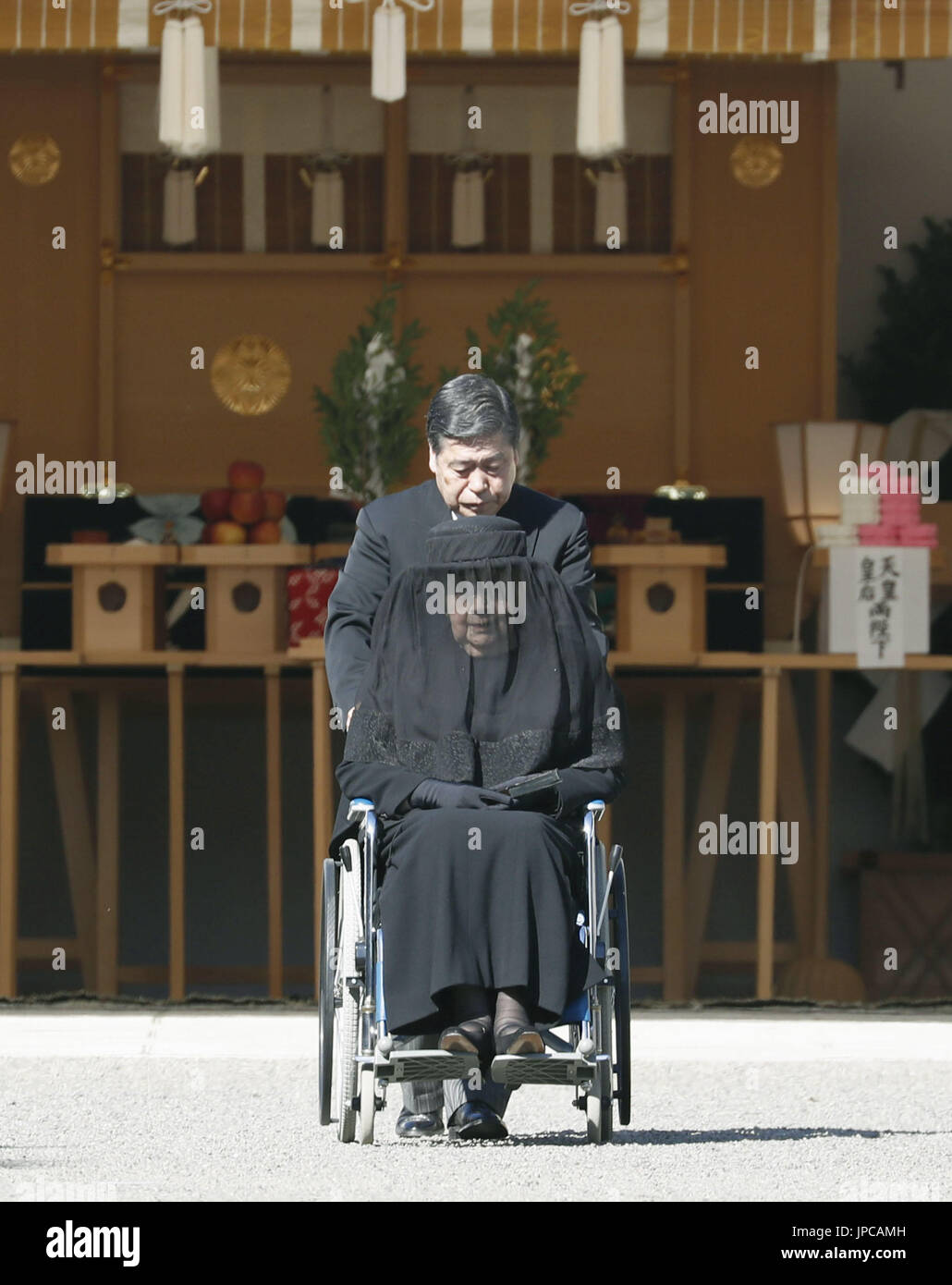 Princess Yuriko (in wheelchair) leaves after praying at the Shinto ...