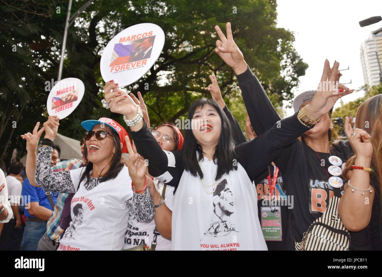 Supporters of former Philippine President Ferdinand Marcos and his ...