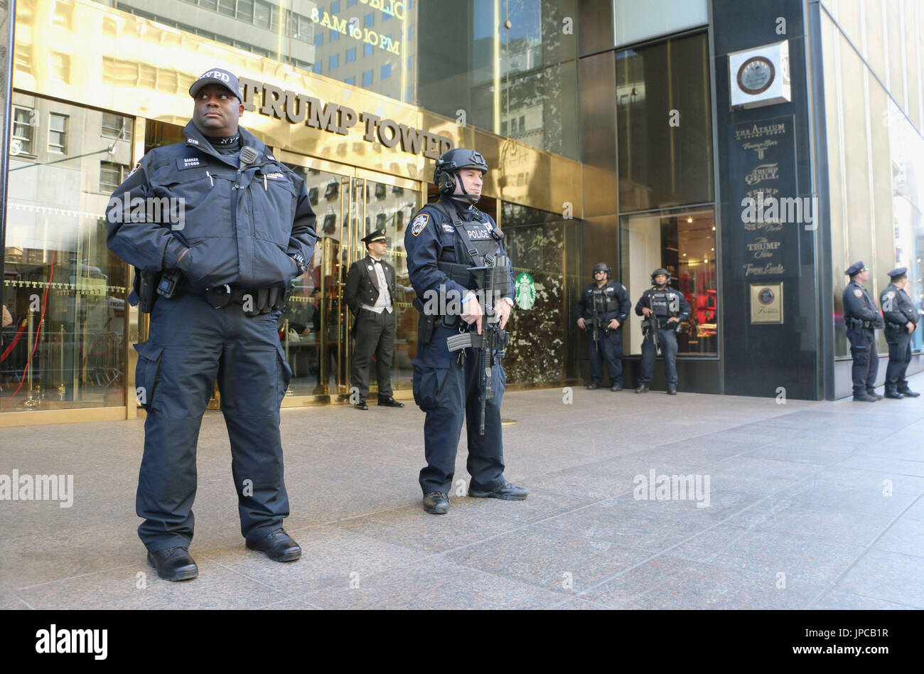 Police officers stand guard in front of Trump Tower in New York on Nov ...