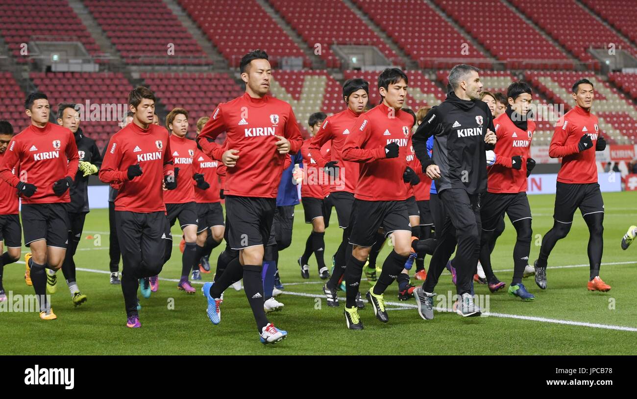 Japanese soccer players work out during a practice session in Kashima ...