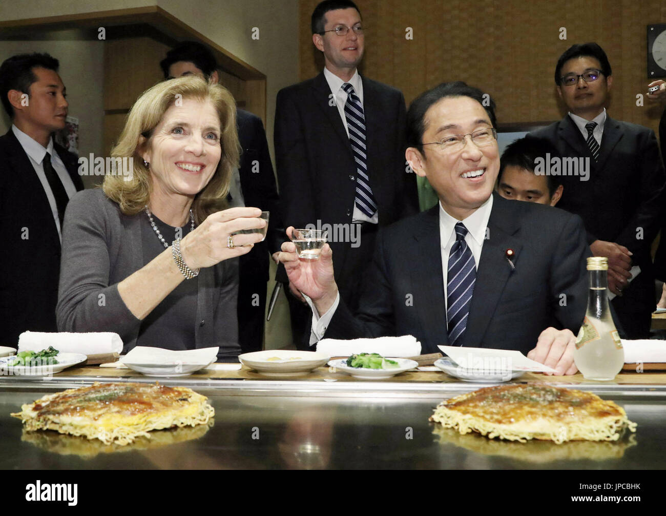 Japanese Foreign Minister Fumio Kishida (R) dines with U.S. Ambassador ...