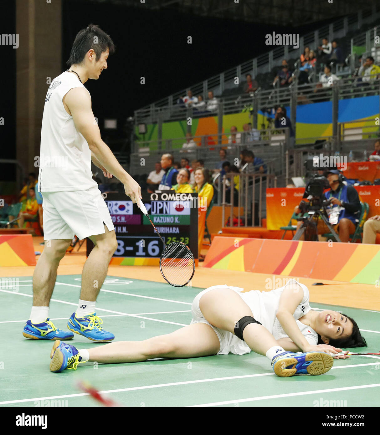 Japan's Ayane Kurihara (R) and Kenta Kazuno are seen during badminton ...