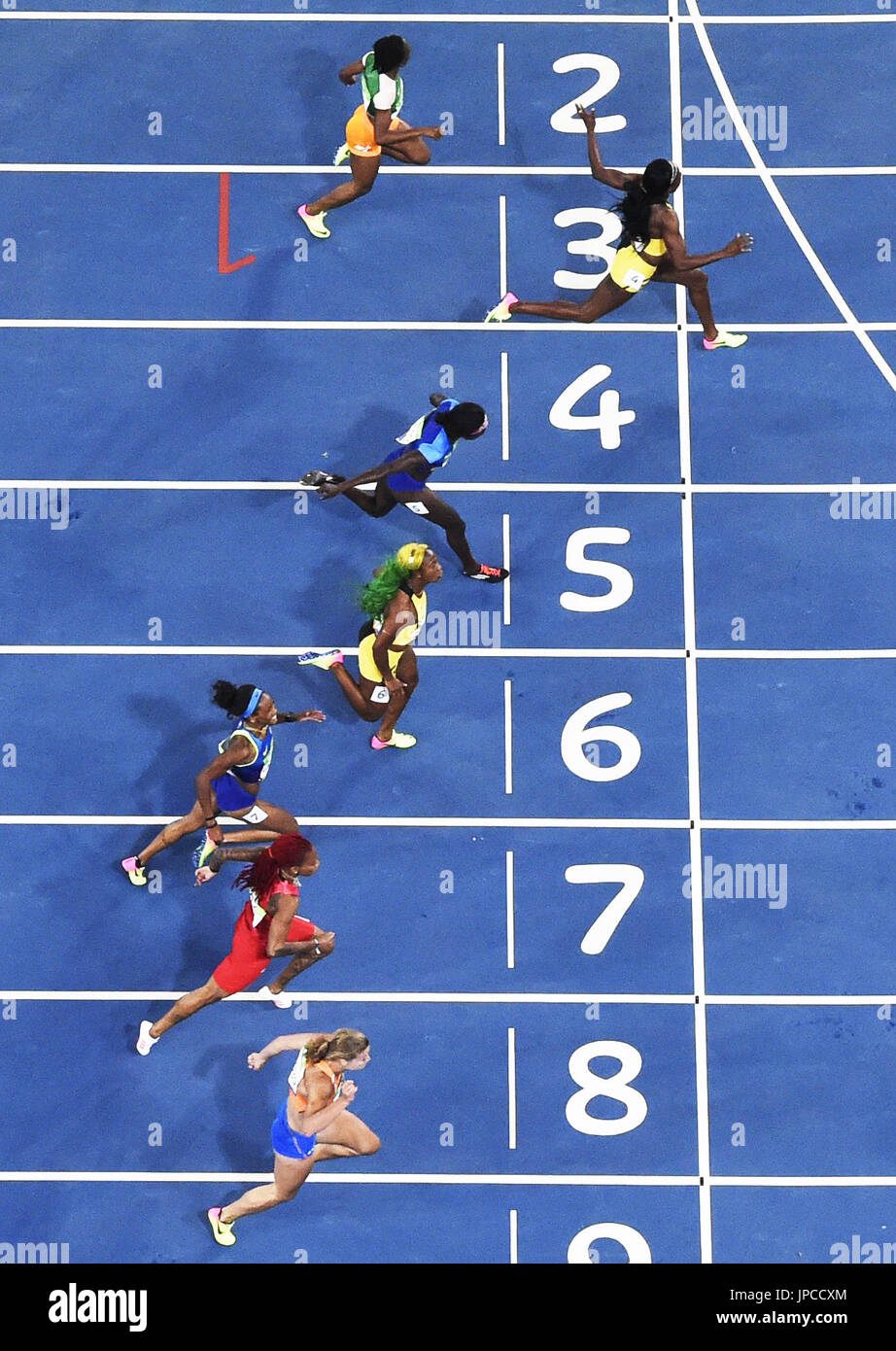 Elaine Thompson of Jamaica crosses the finish line as she wins the ...