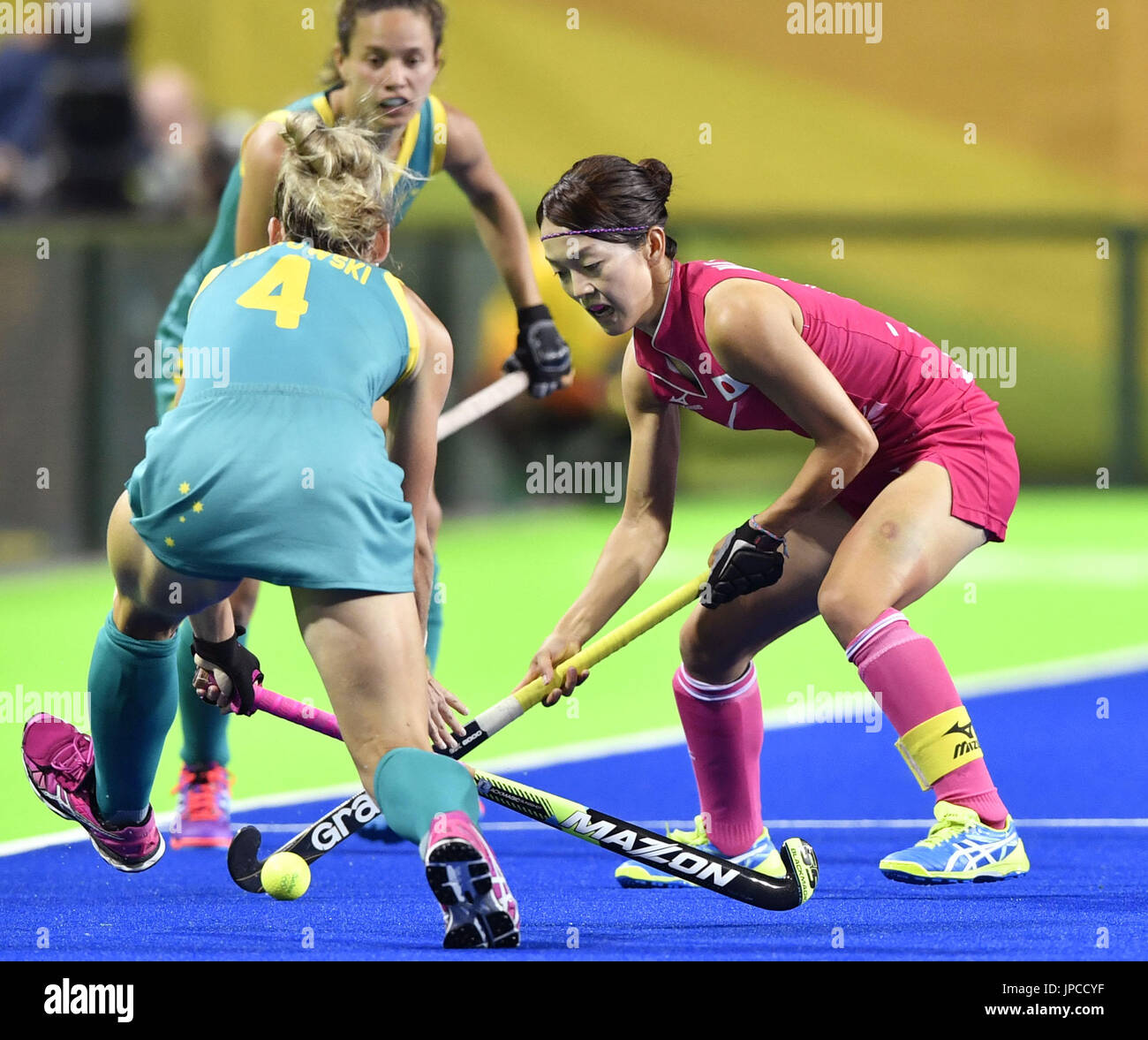 Australia's Casey Sablowski (4) challenges Japan's Miyuki Nakagawa (R ...