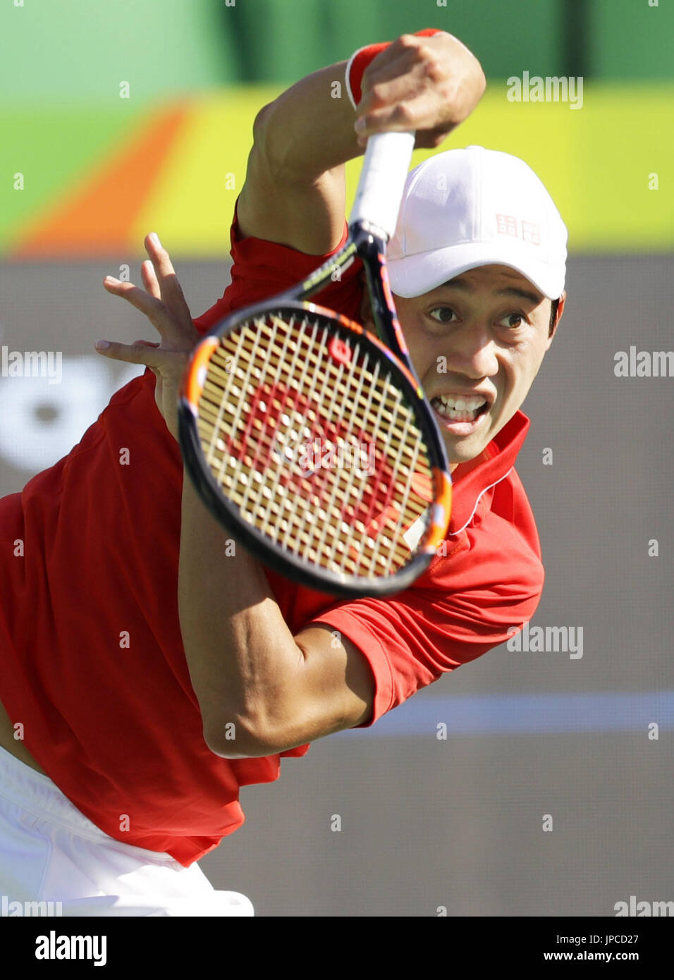Japan's Kei Nishikori serves during his bronze-medal match against ...