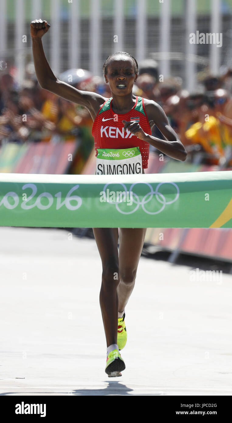 Kenya's Jemima Sumgong crosses the finish line to win the women's ...
