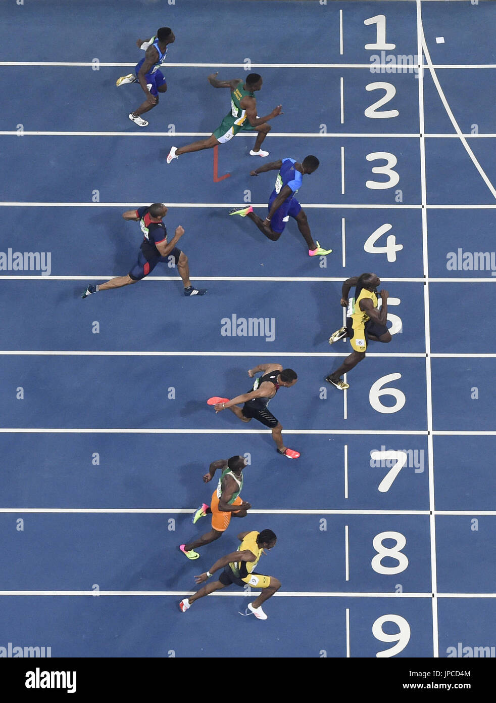 Usain Bolt of Jamaica crosses the finish line in the men's 100-meter ...