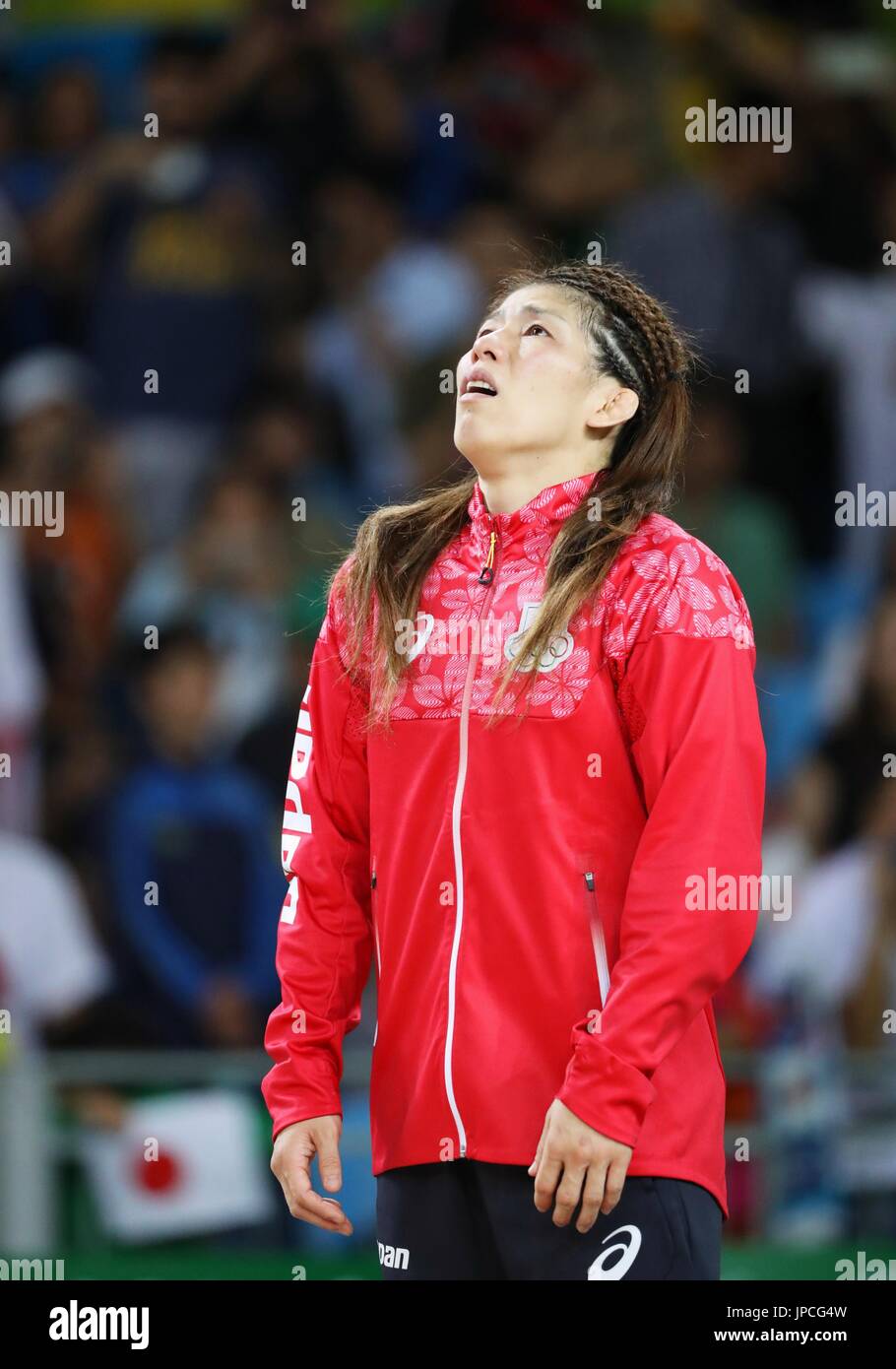 Saori Yoshida of Japan looks up during the medal ceremony for the women ...