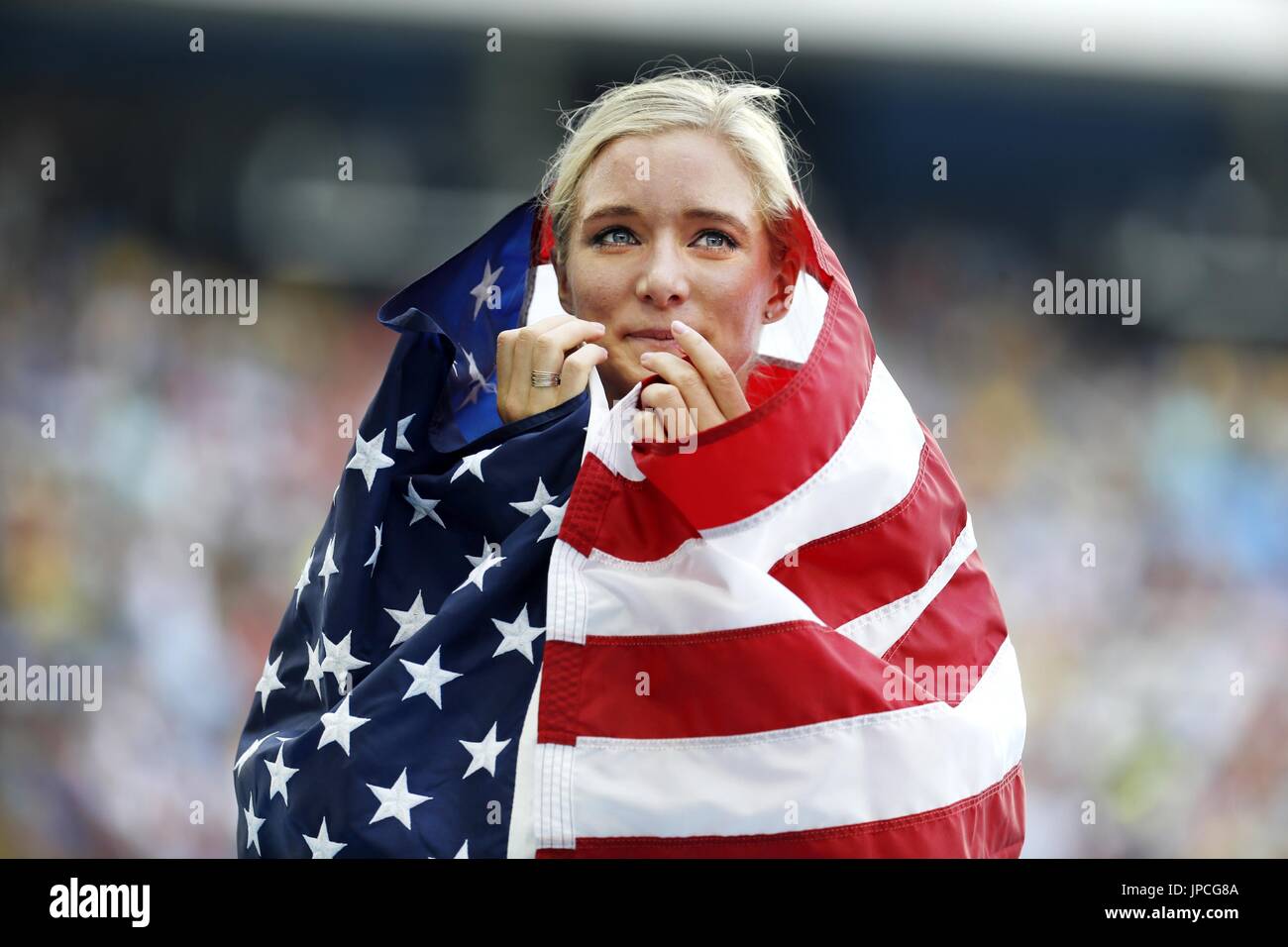 Emma Coburn of the United States wraps herself with a U.S. flag after ...