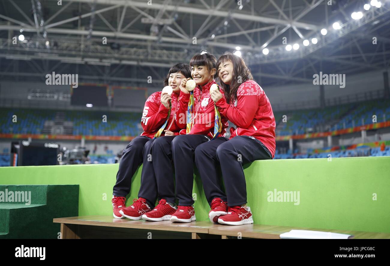 (From L) Japanese wrestlers Sara Dosho, Kaori Icho and Eri Tosaka pose ...