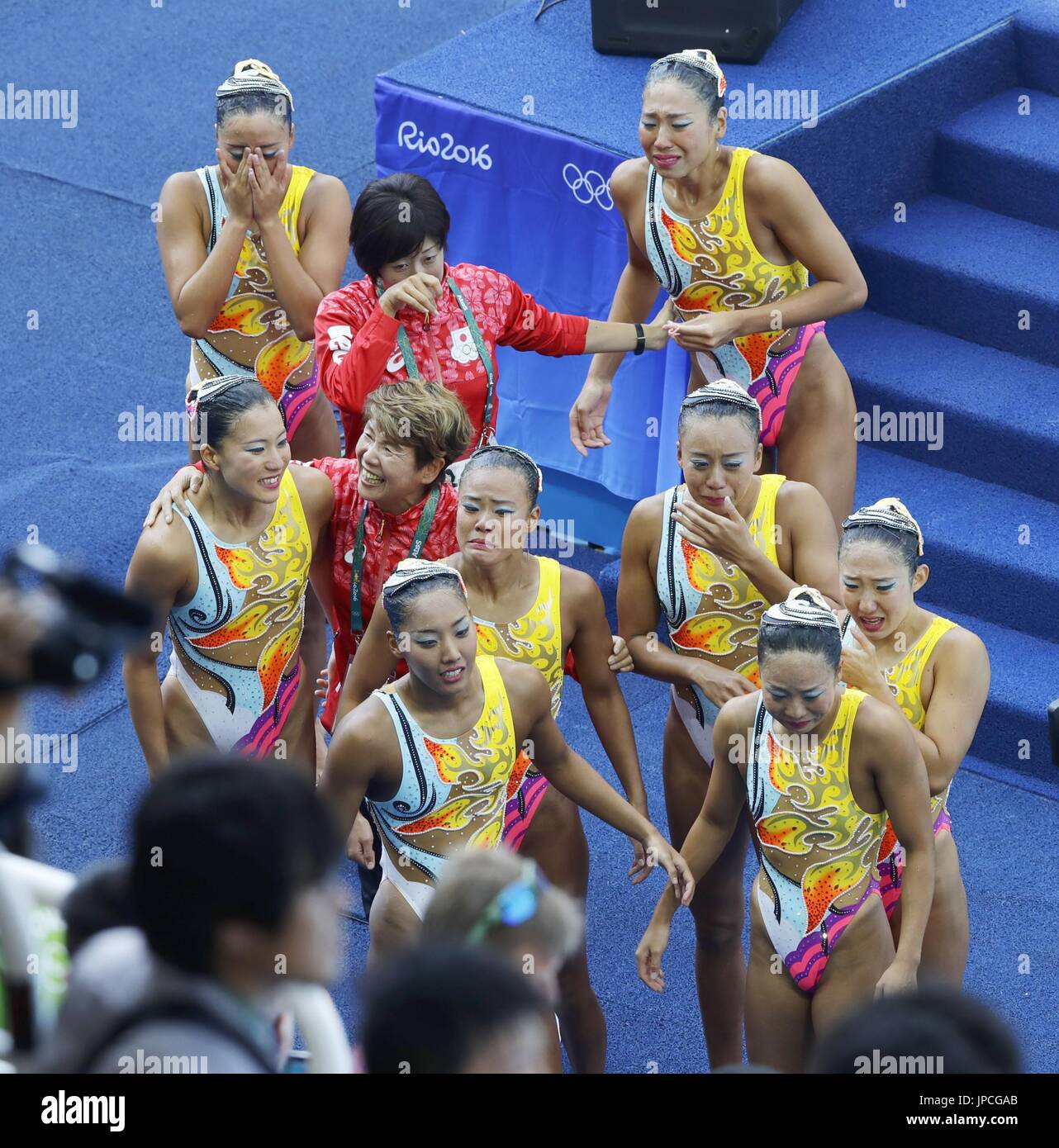 Japan synchronized swimming team members celebrate after winning the ...