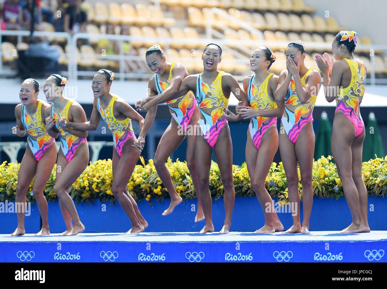 Japan's synchronized swimming team members celebrate after competing in ...