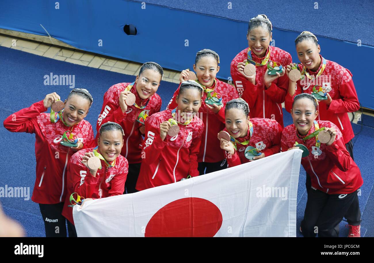 Japan's synchronized swimming team members pose for a photo after ...