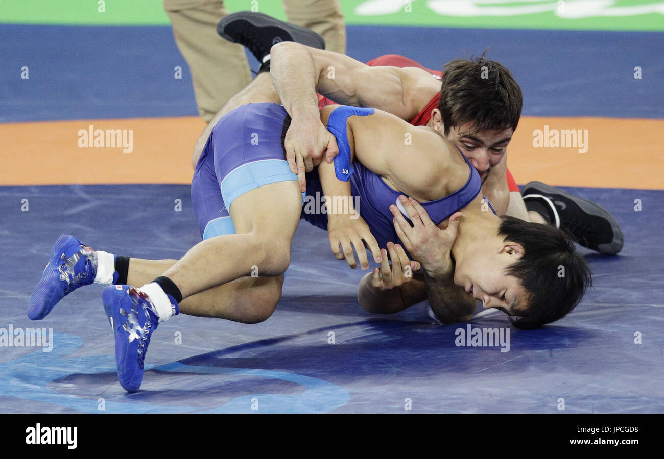 Georgian wrestler Vladimer Khinchegashvili (red) and Rei Higuchi of ...