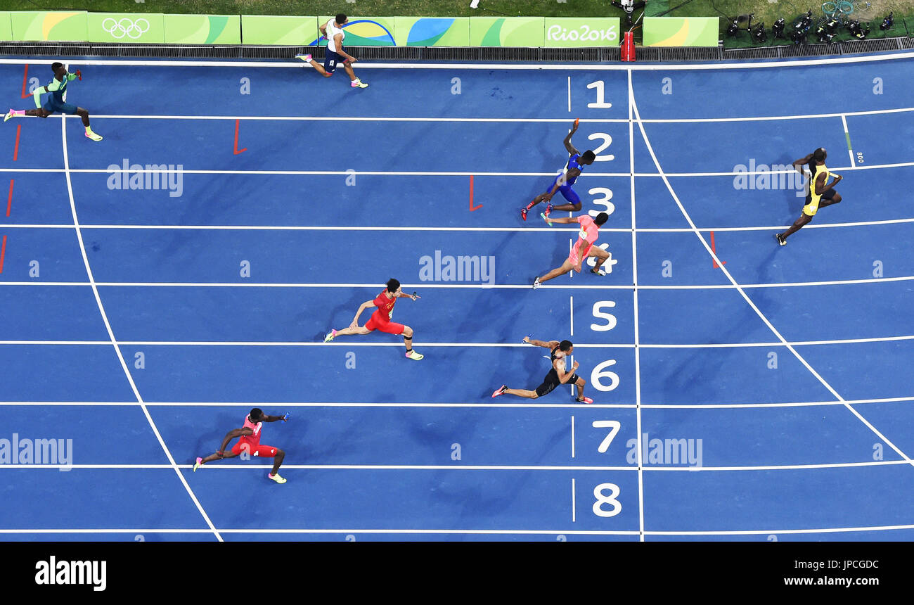 Japan's Asuka Cambridge (lane 5) crosses the finish line in the men's ...