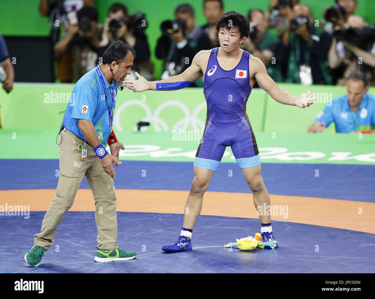 Japanese freestyle wrestler Rei Higuchi (R) reacts to a judgment during ...