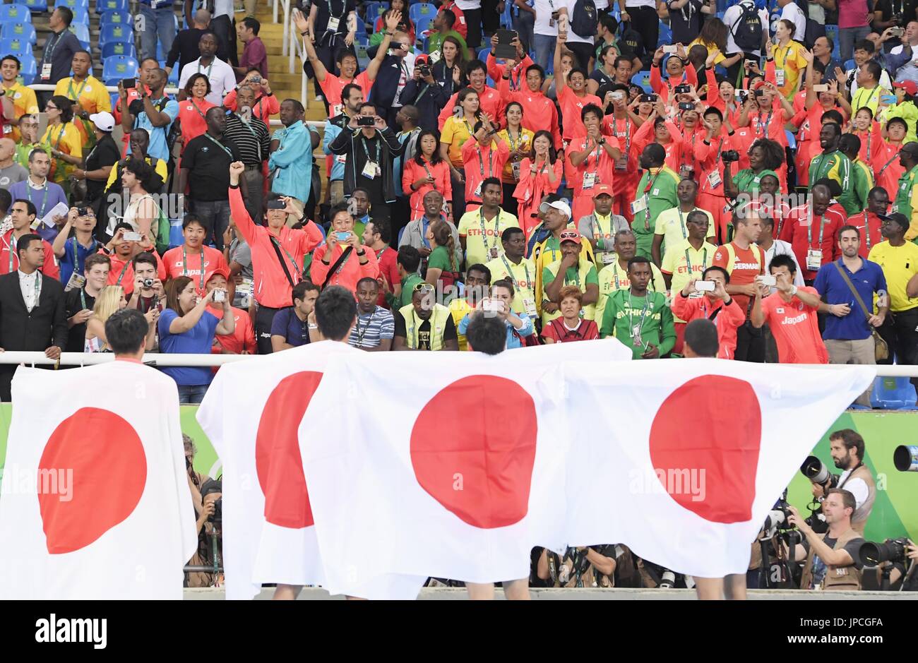 Japan's 4x100-meter relay members acknowledge the crowd after winning ...