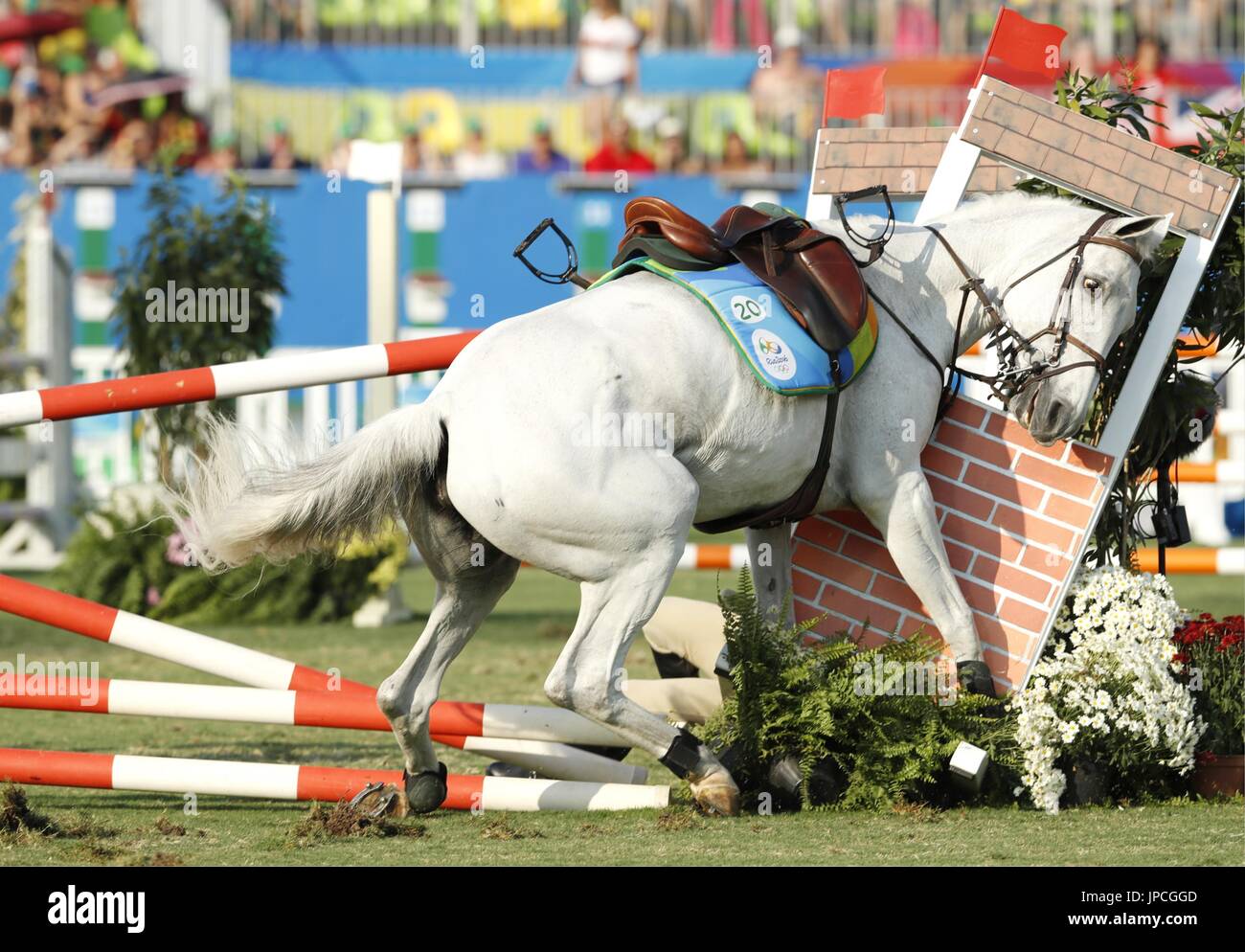 A horse crashes against a fence during the women's individual horse ...