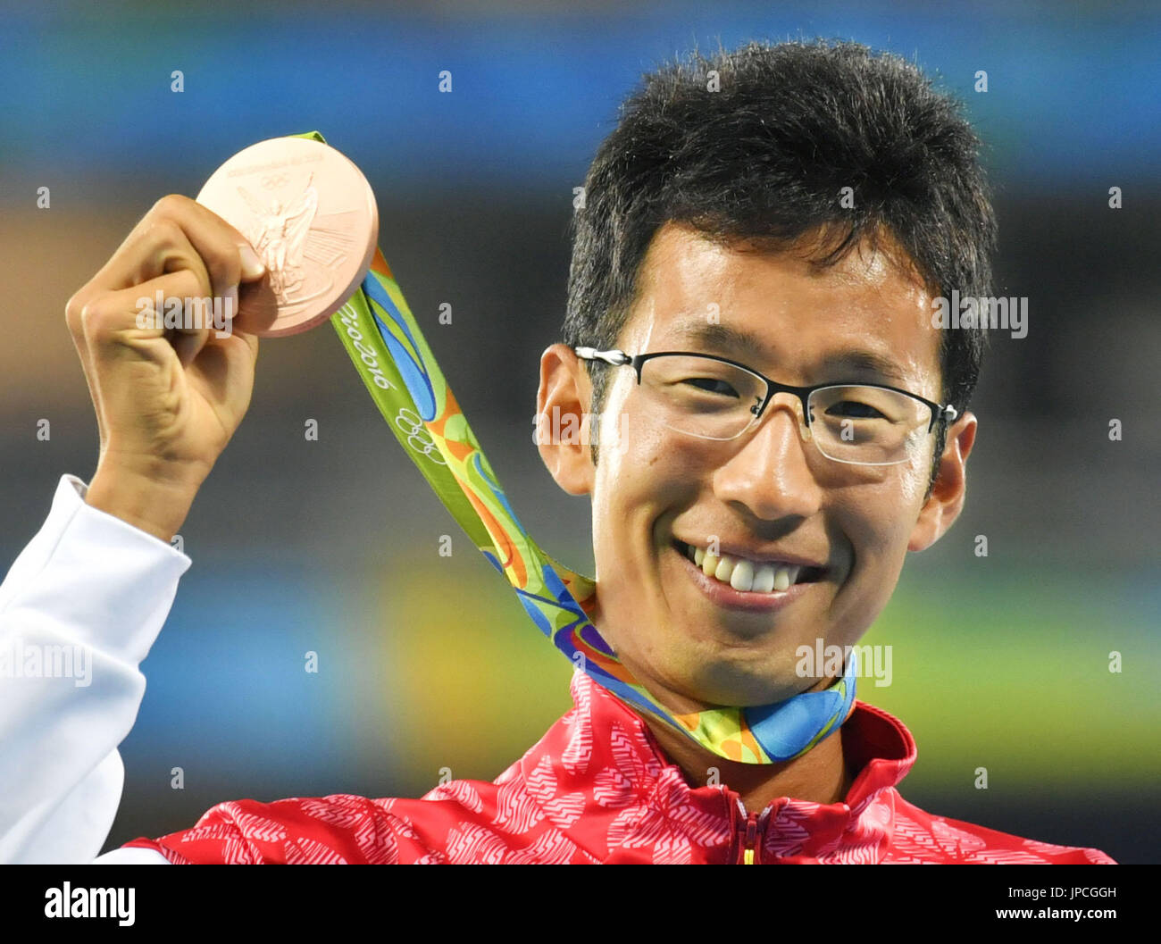 Bronze medalist Hirooki Arai of Japan holds his bronze medal during the ...