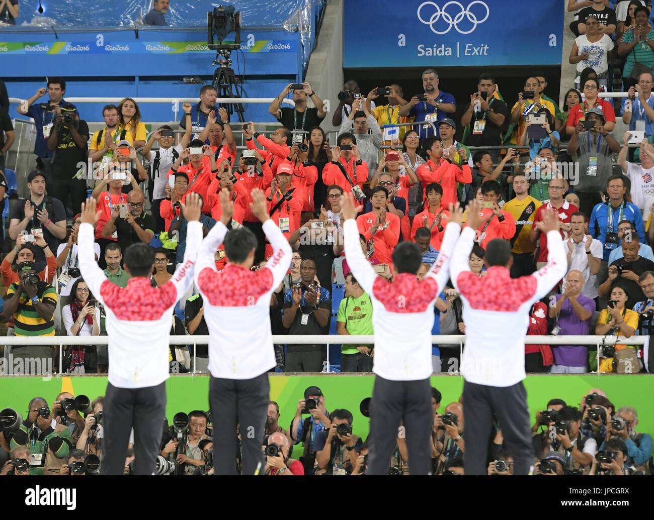 Spectators in the stand applaud the Japanese men's 4x100-meter relay ...