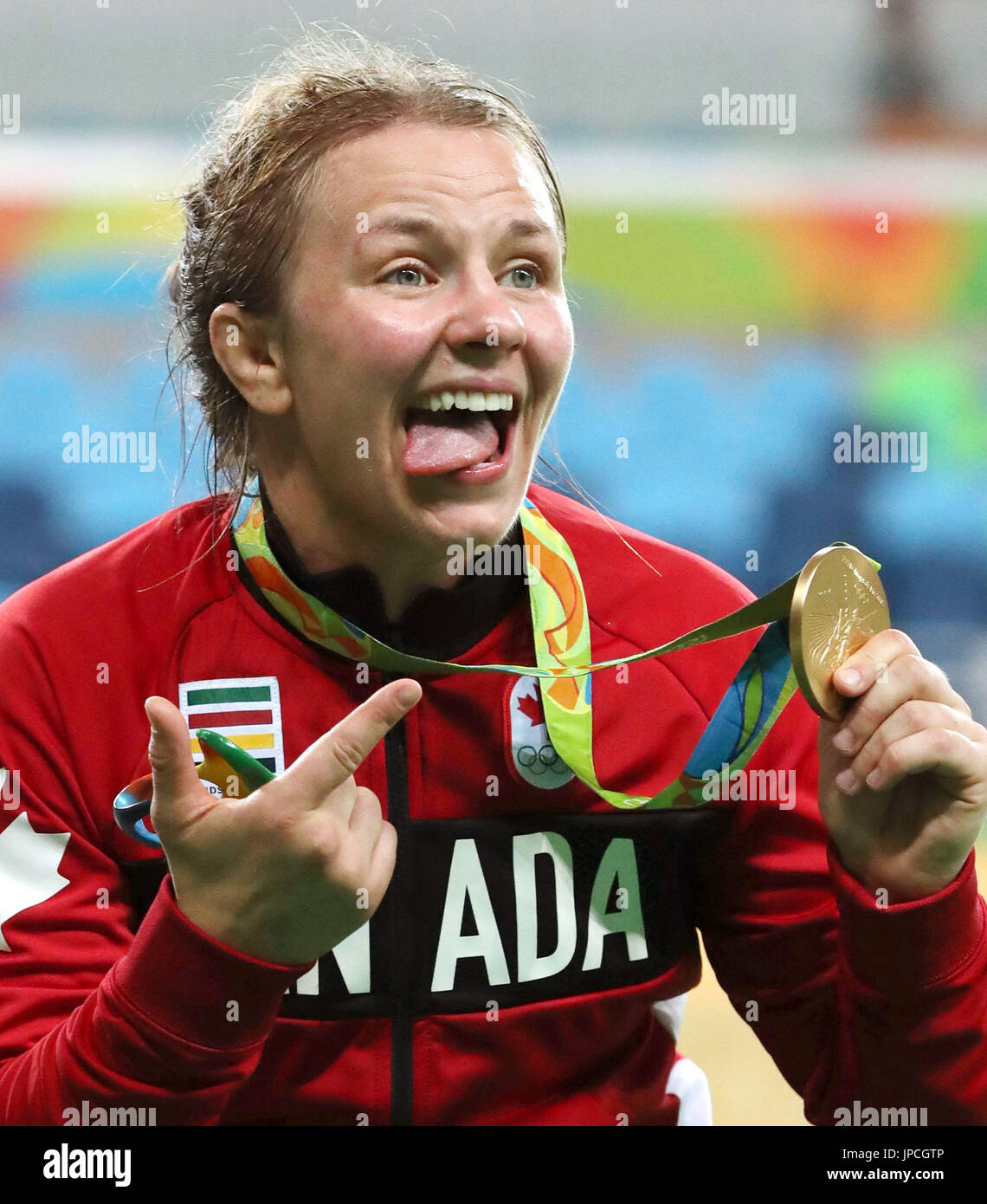 Erica Wiebe of Canada poses with her gold medal for the women's ...