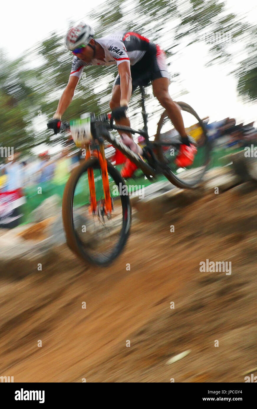 Kohei Yamamoto of Japan competes in the men's cross-country cycling ...